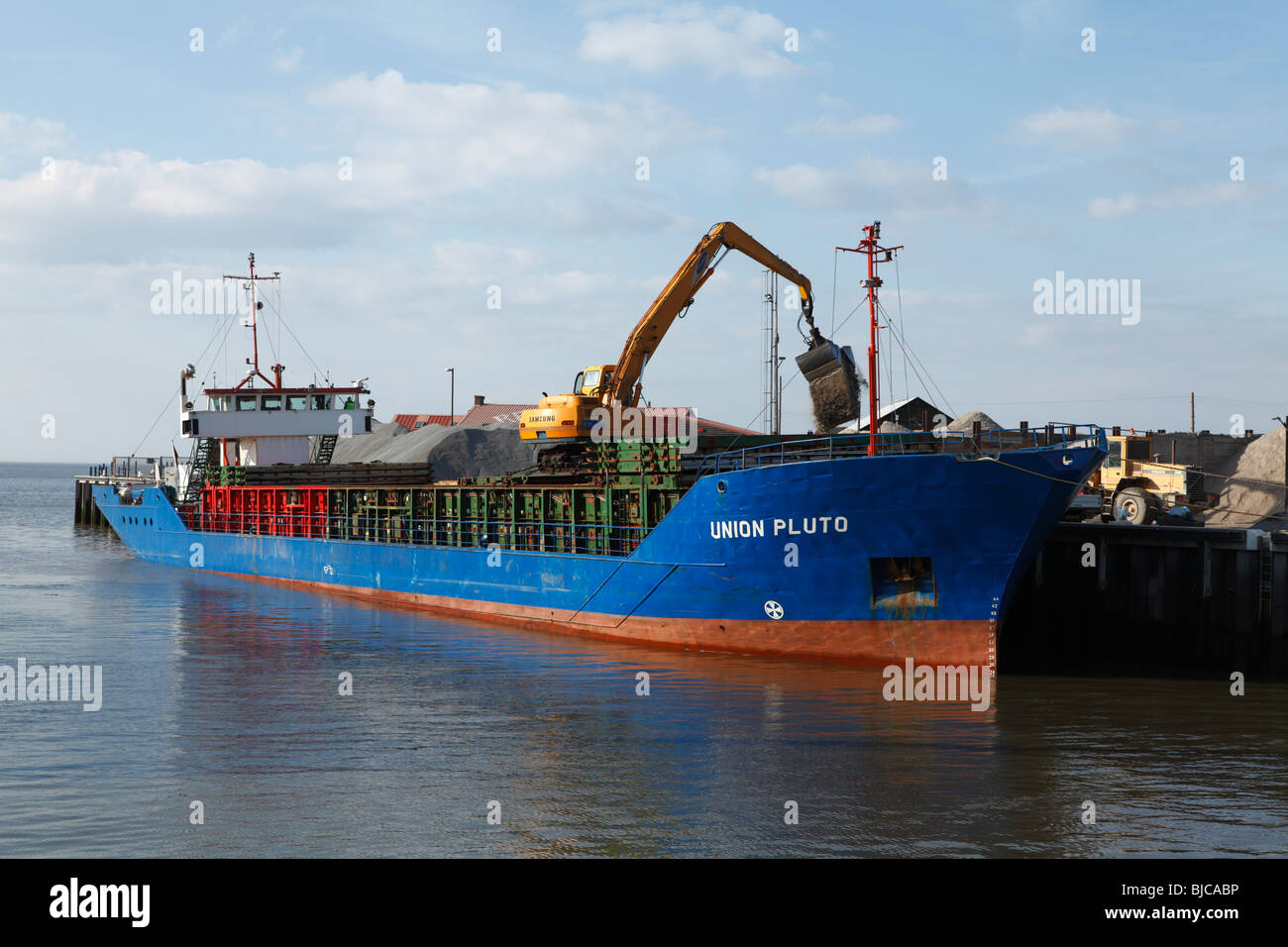 Unloading of aggregates from a ship for Bretts at Whitstable harbour's ...