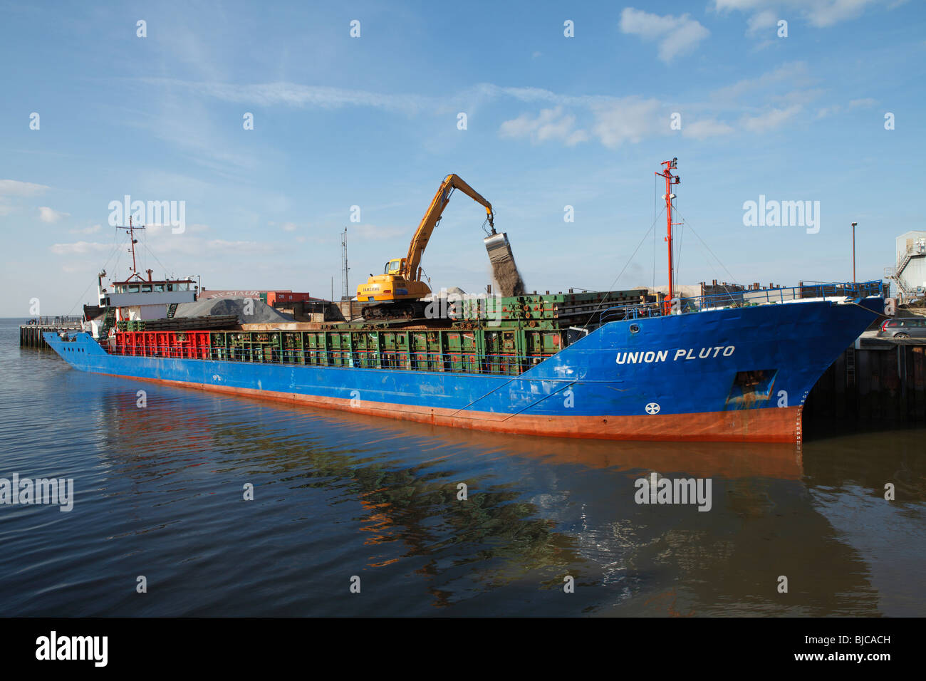 Unloading of aggregates from a ship for Bretts at Whitstable harbour's ...