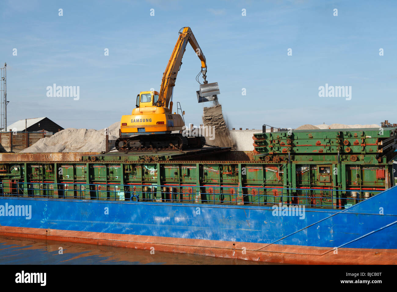 Unloading of aggregates from a ship for Bretts at Whitstable harbour's ...