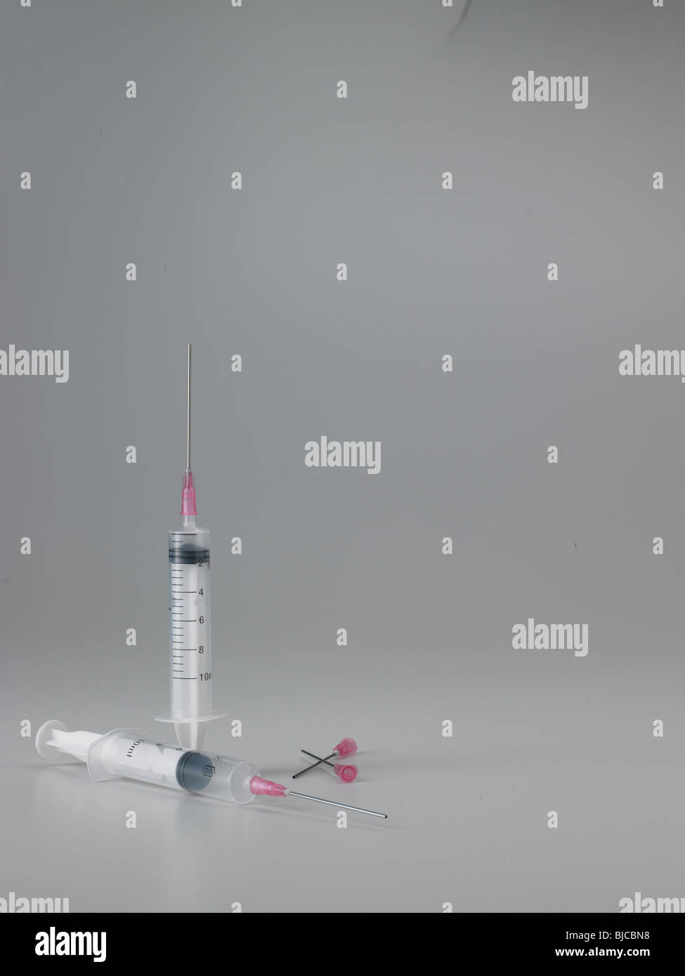Syringes and needles page layout friendly Stock Photo - Alamy
