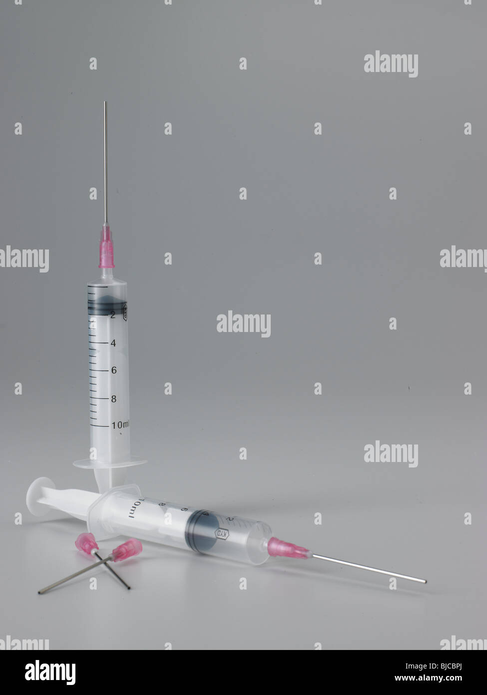 Syringes and needles close crop Stock Photo - Alamy