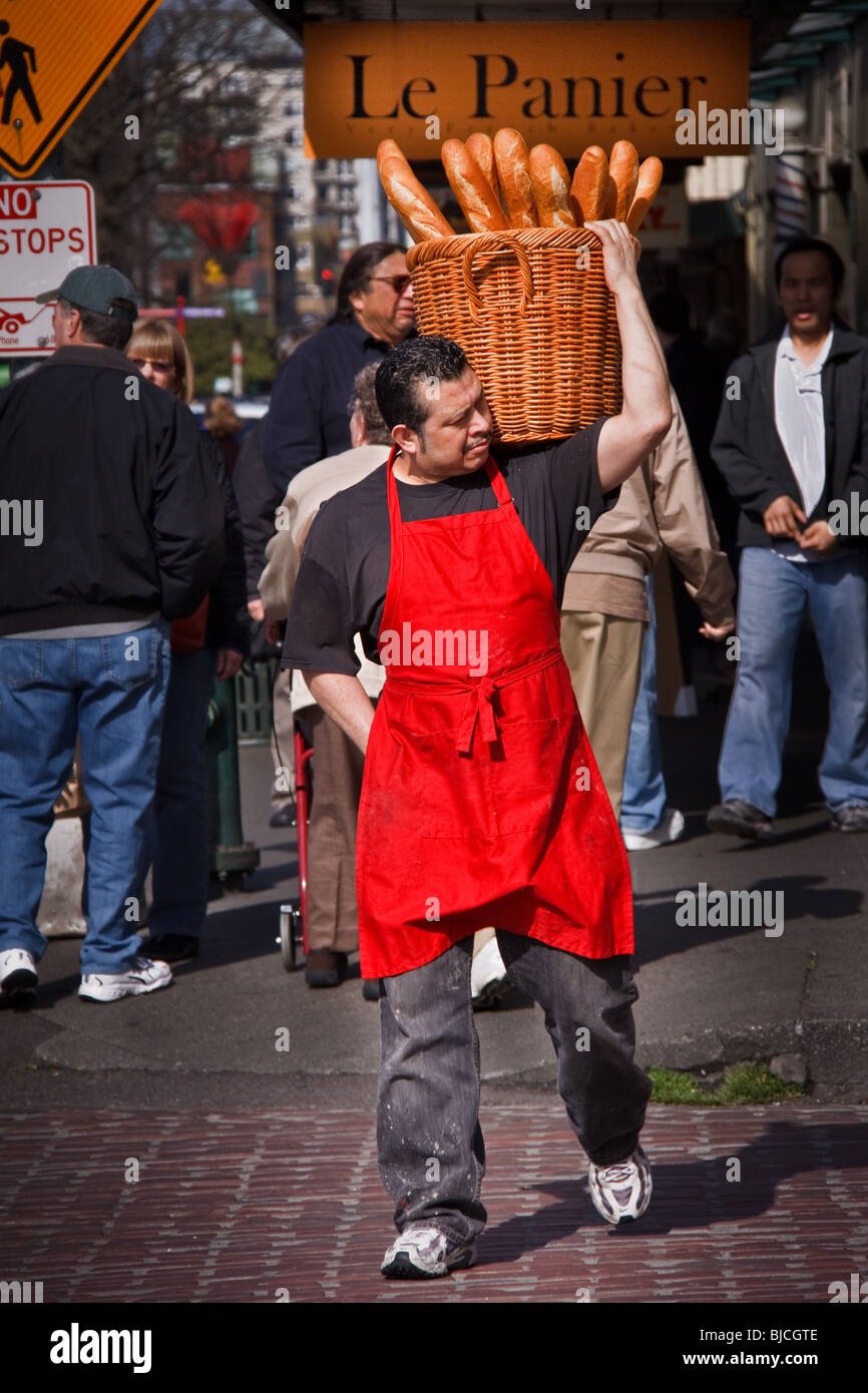 Man carrying bread from bakery hi-res stock photography and images - Alamy