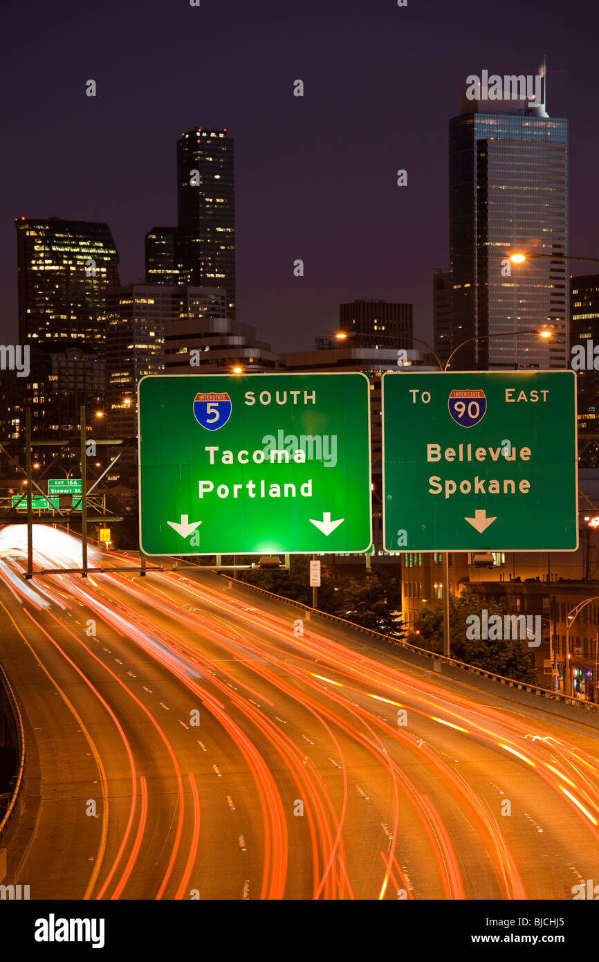Vehicle taillights on Interstate 5 with Seattle skyline in background ...