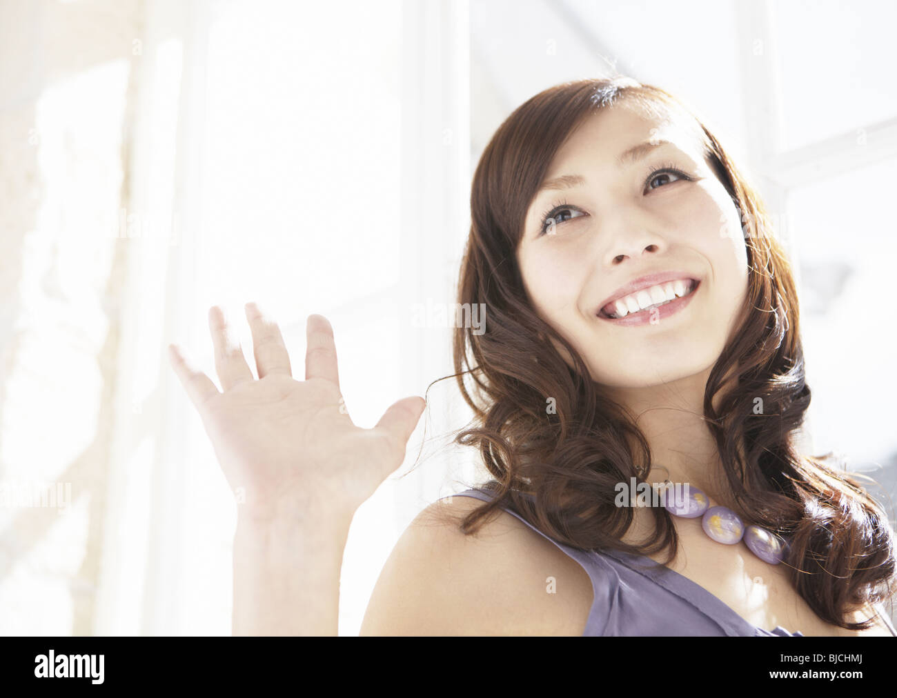A woman handwaving Stock Photo - Alamy
