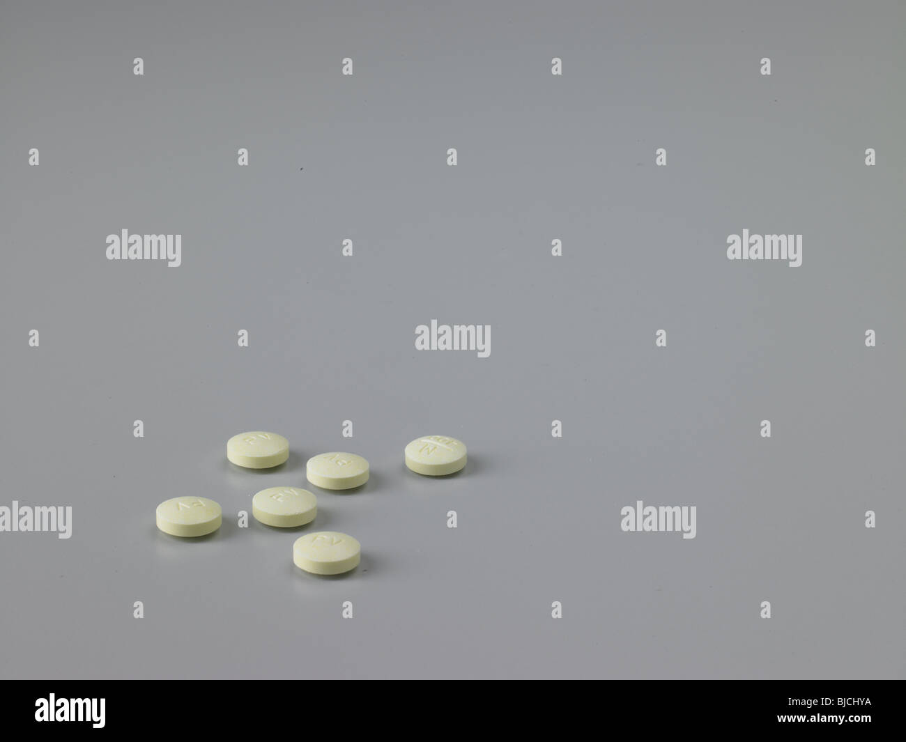 six medical tablets on grey background Stock Photo - Alamy