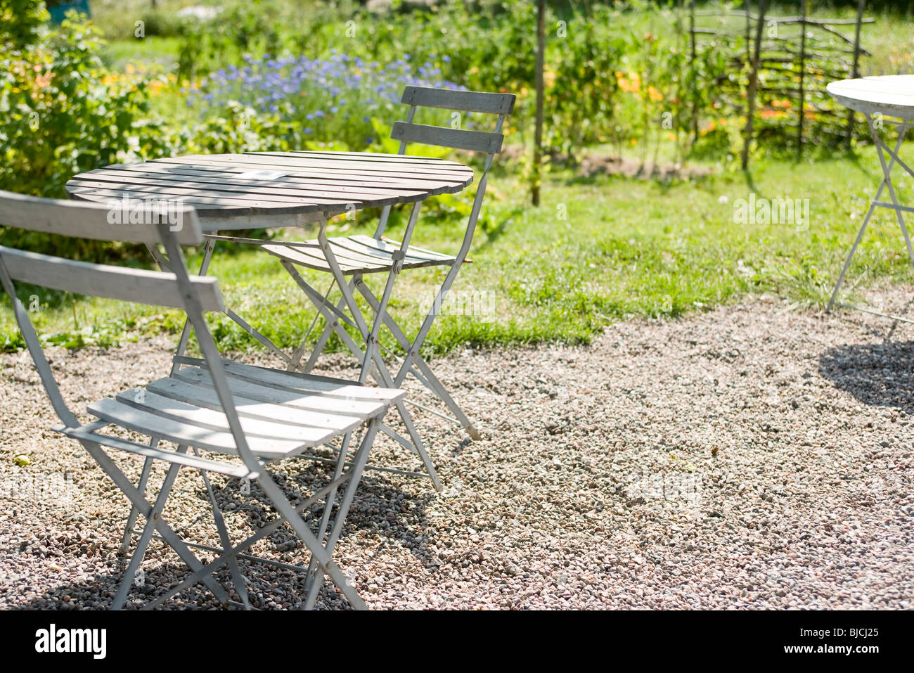 Table and chair on backyard terrace Stock Photo - Alamy