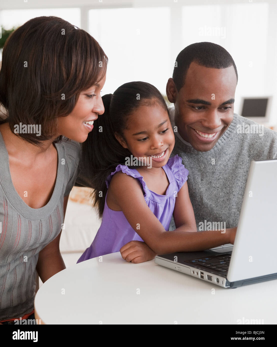 African American family using laptop together Stock Photo - Alamy