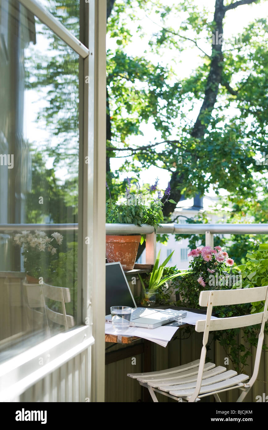 Laptop computer on patio table Stock Photo - Alamy