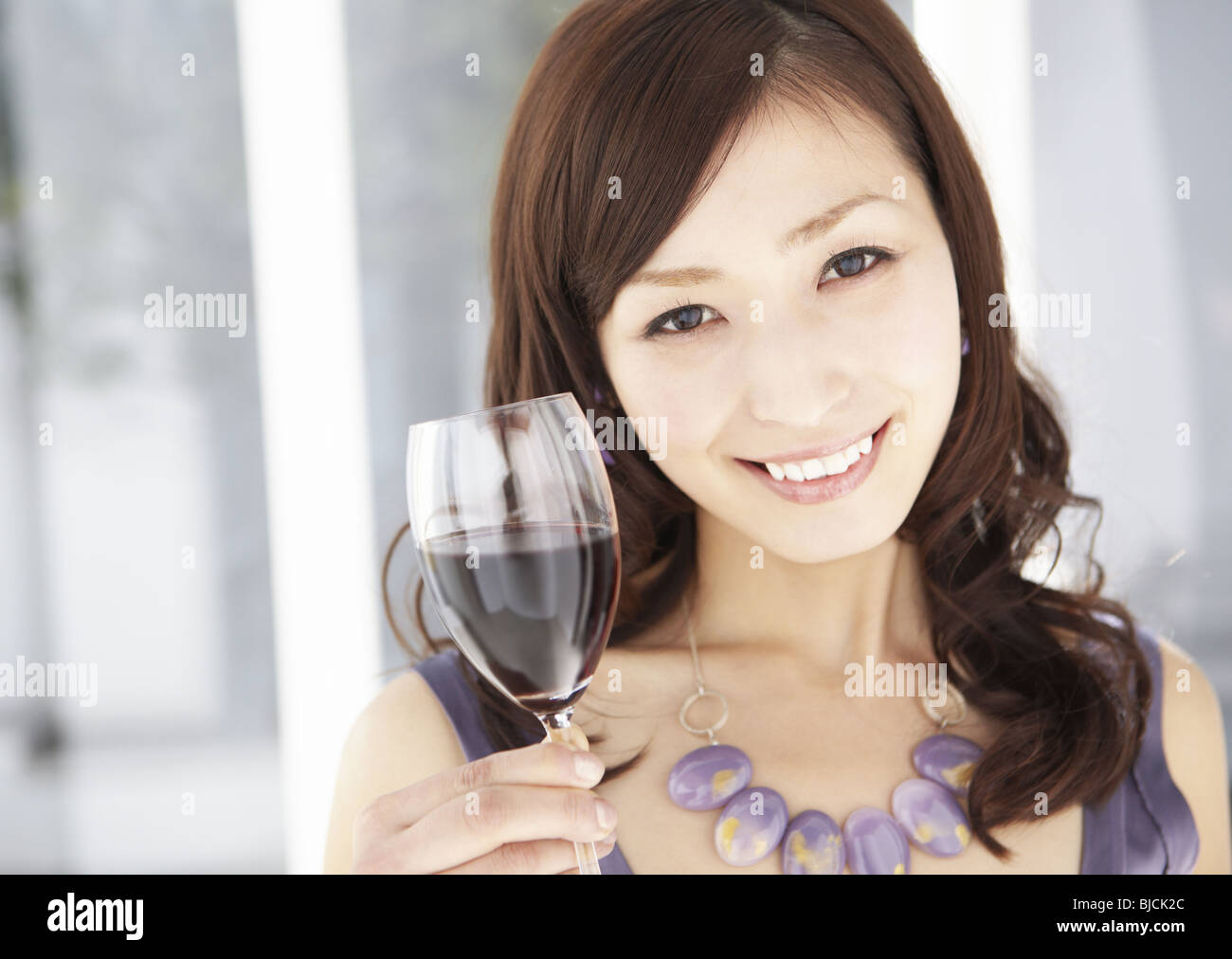A woman enjoying wine Stock Photo - Alamy