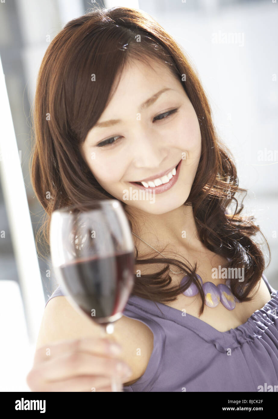 A woman enjoying wine Stock Photo - Alamy
