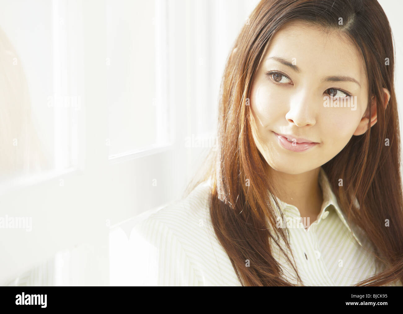 A woman by the window Stock Photo - Alamy