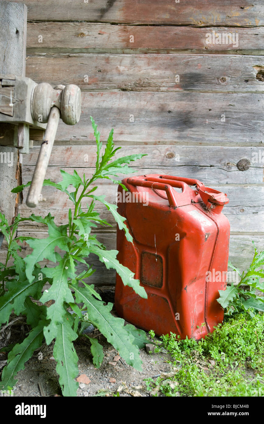Gas can on ground outdoors Stock Photo - Alamy