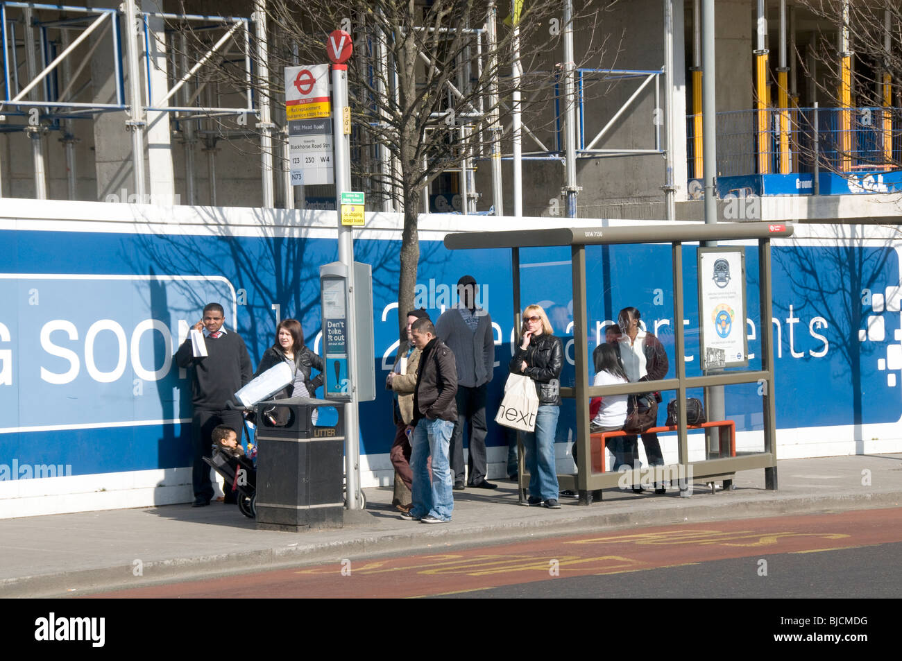 UK PASSENGERS WAITING FOR BUS IN TOTTENHAM LONDON Stock Photo - Alamy