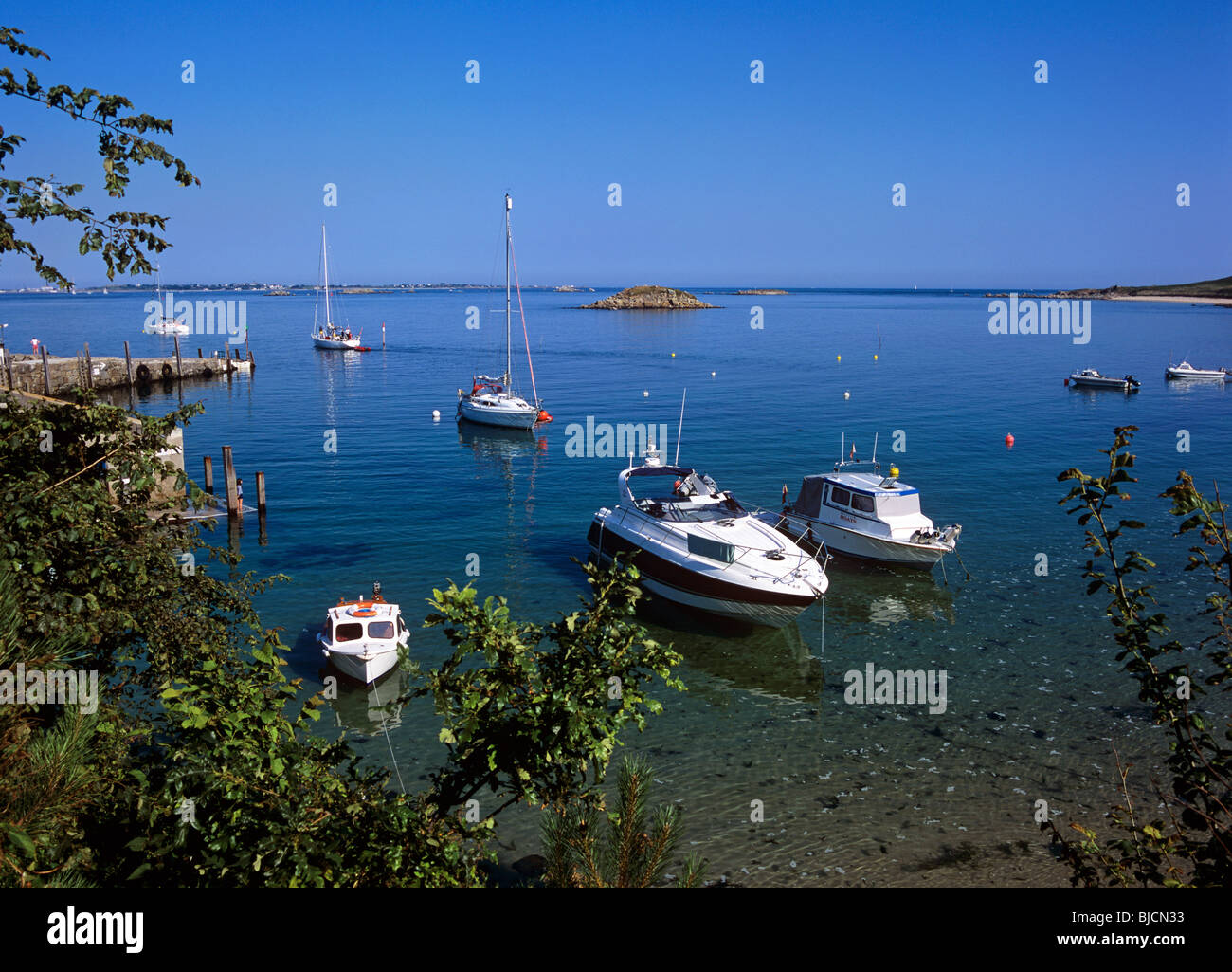 Picturesque Herm Harbour, the main port for the island Stock Photo - Alamy