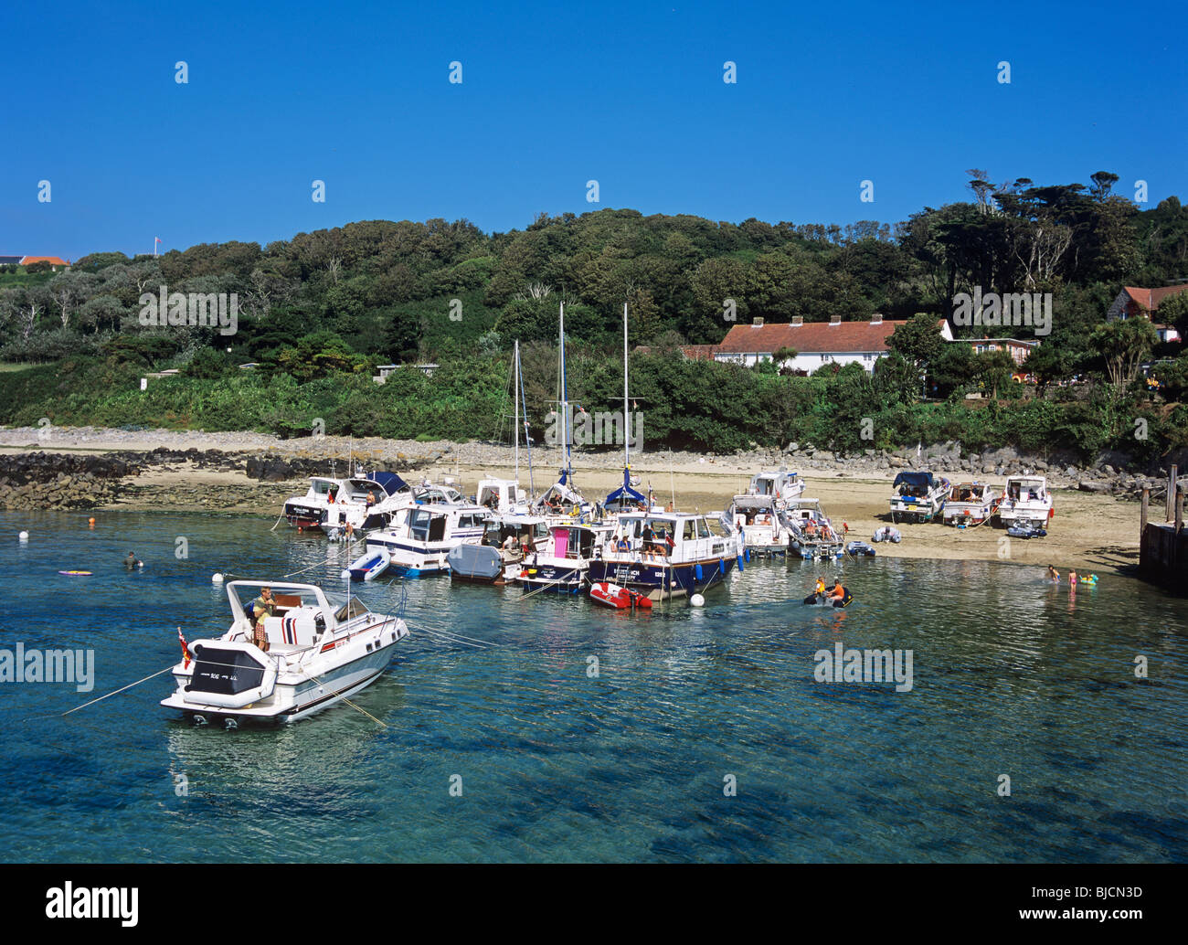 Picturesque Herm Harbour, the main port for the island Stock Photo - Alamy