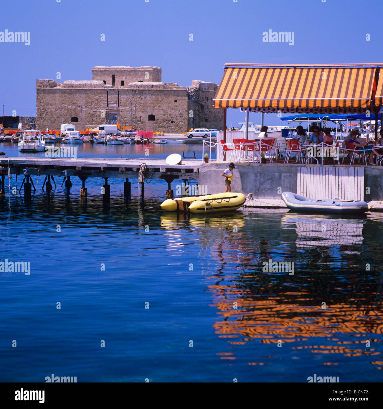 Bars and restaurants by the fishing harbour with views of the old ...
