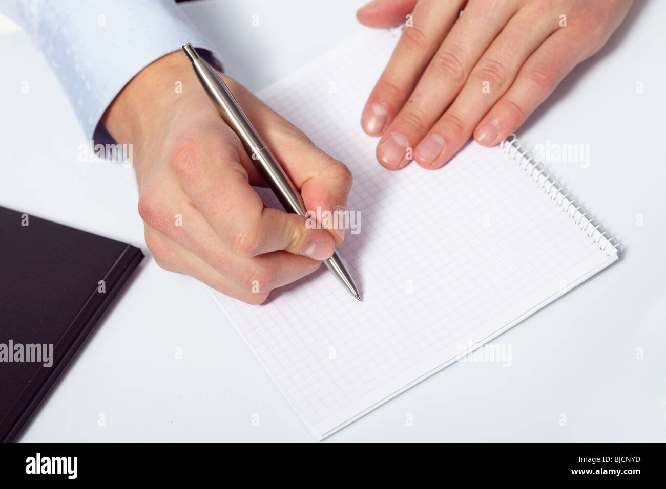 businessman's hand with pen Stock Photo - Alamy