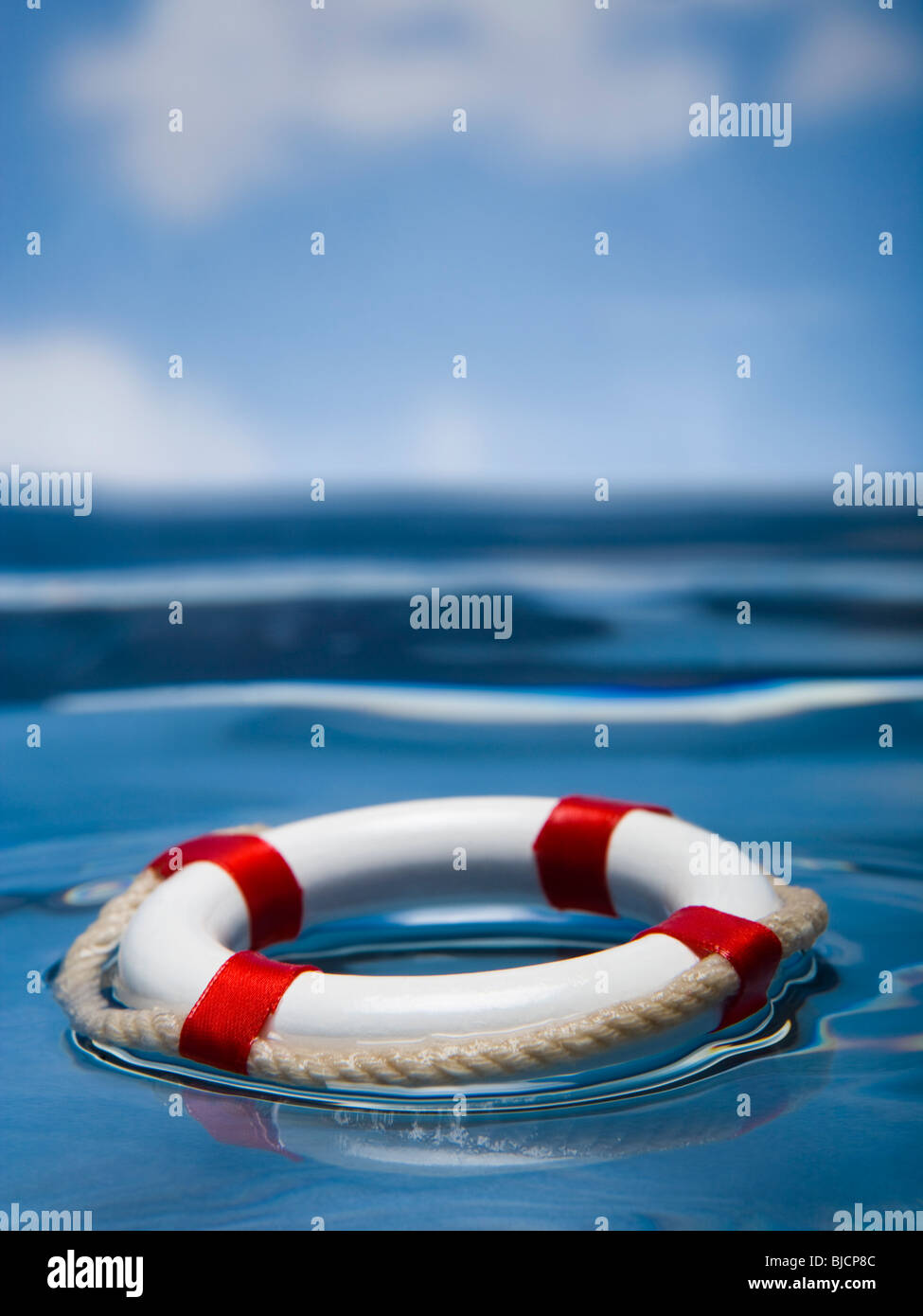 Life preserver floating in water Stock Photo - Alamy