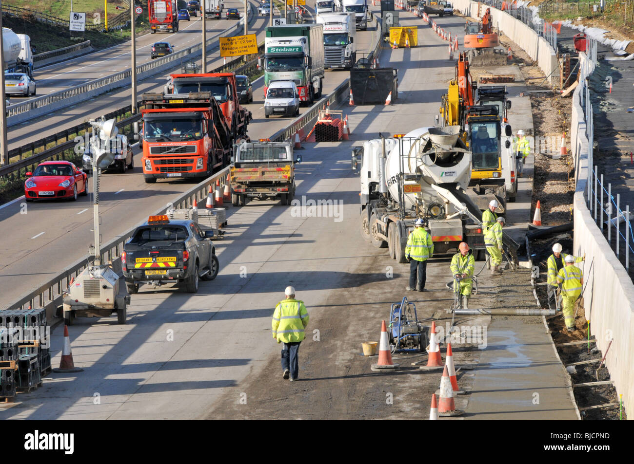 Aerial view M25 Motorway London Orbital Route high visibility workmen ...