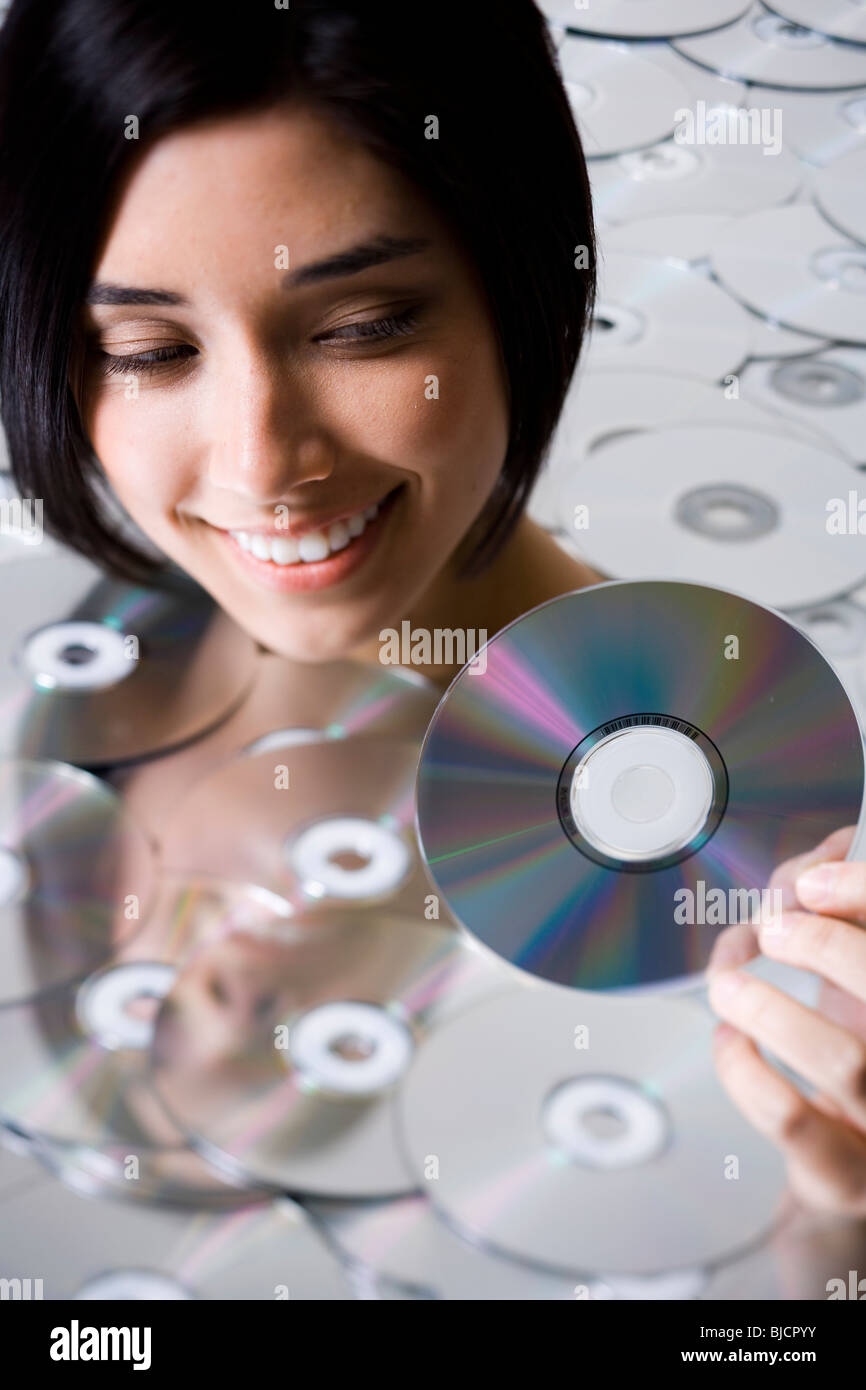 Woman with DVDs Stock Photo - Alamy