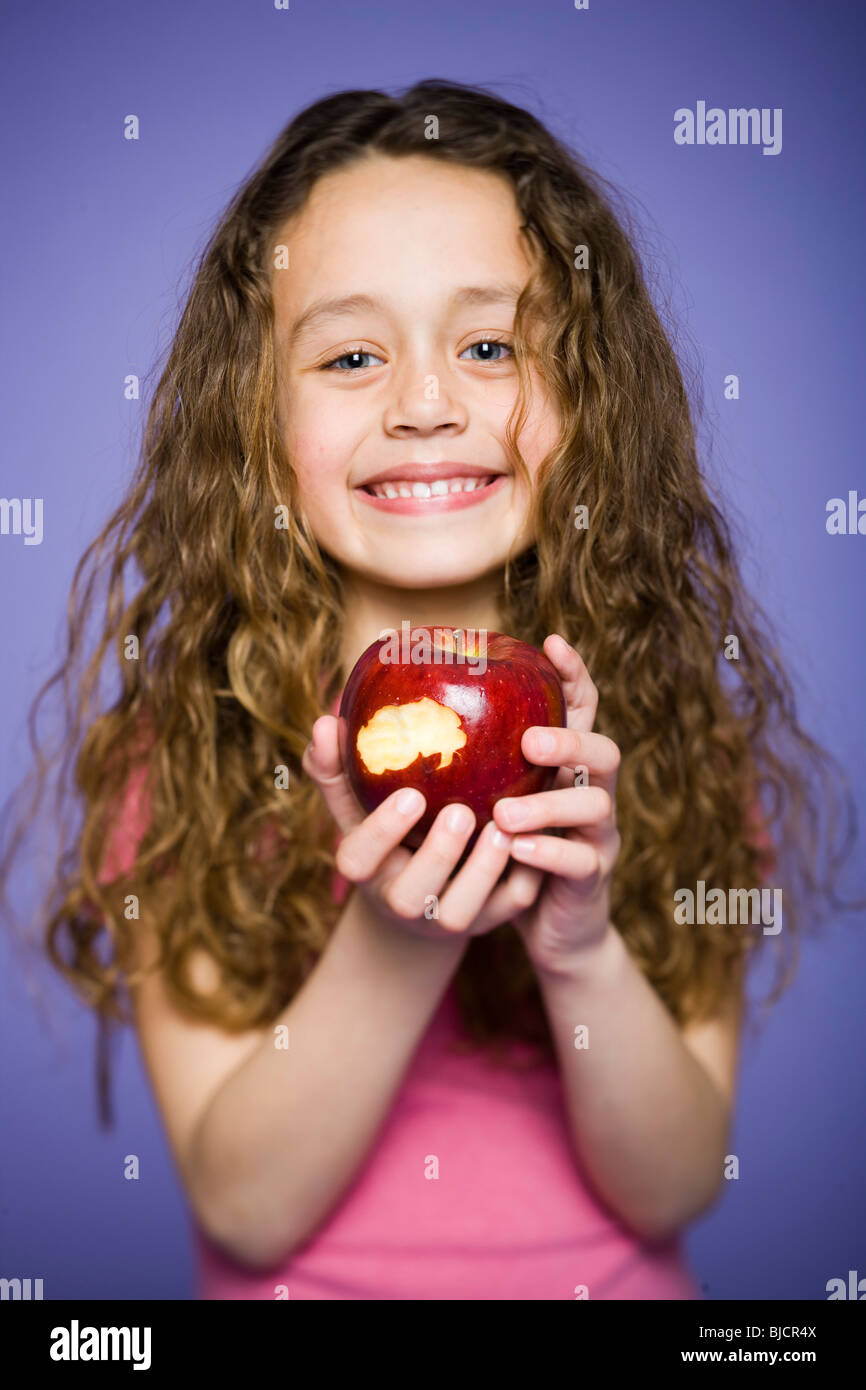 Girl eating apple Stock Photo - Alamy