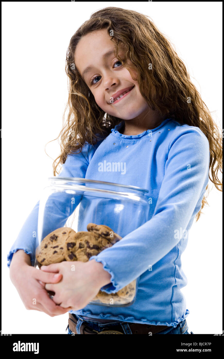 Girl eating cookies Stock Photo - Alamy
