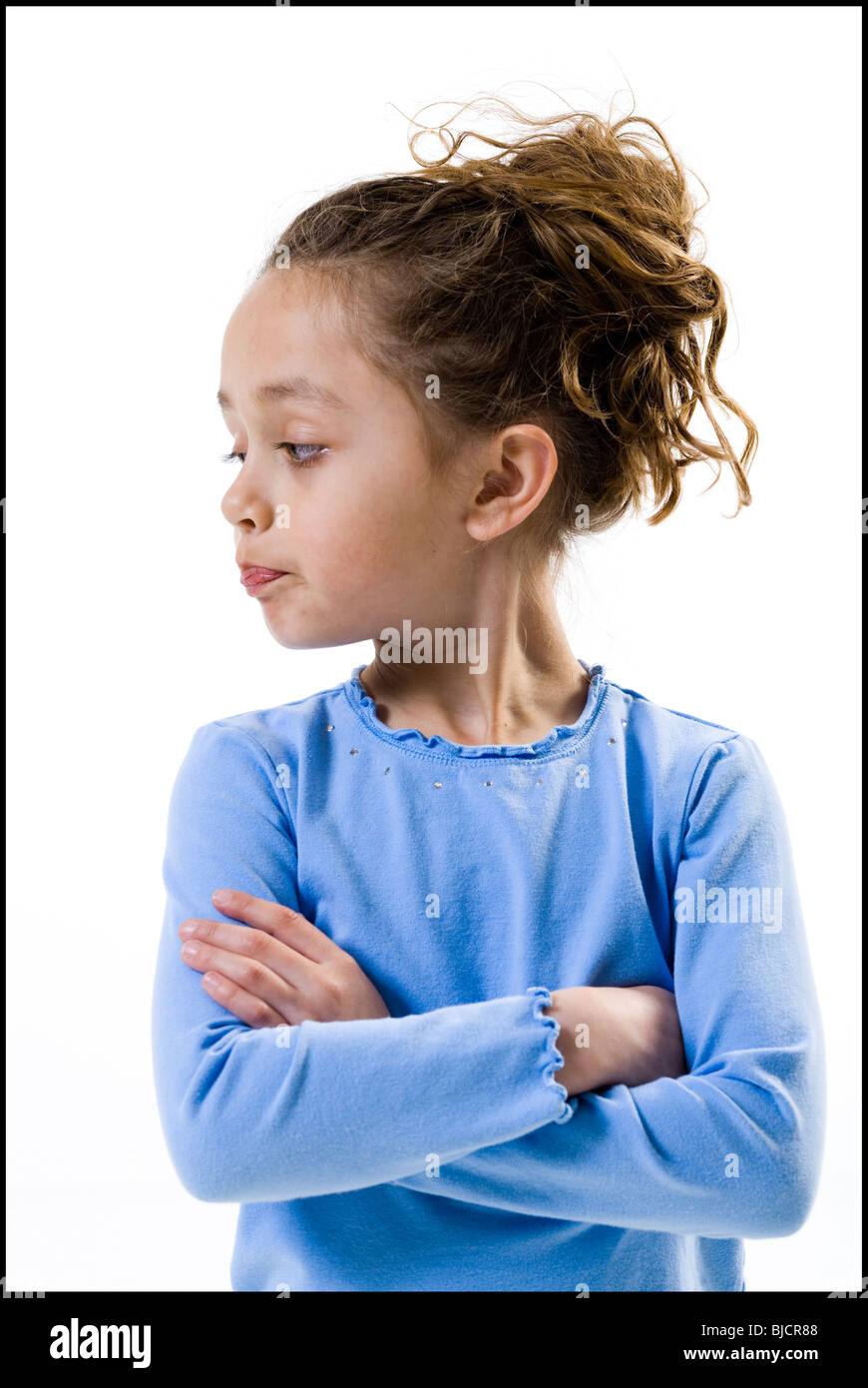 Girl with folded arms Stock Photo - Alamy