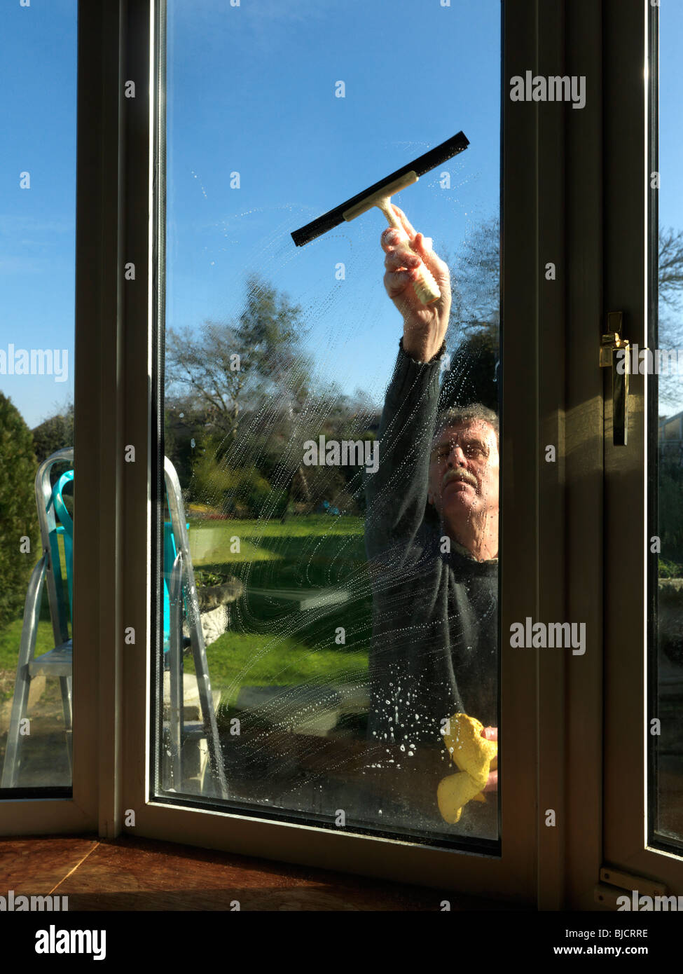 A window Cleaner Taken from the Inside Stock Photo - Alamy