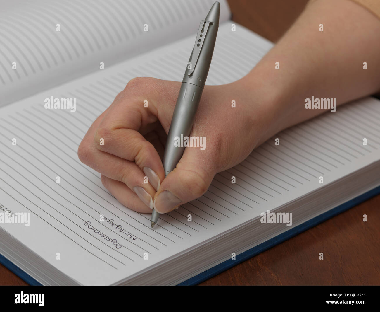Hand Holding Pen Wrinting Notes Close up Stock Photo - Alamy