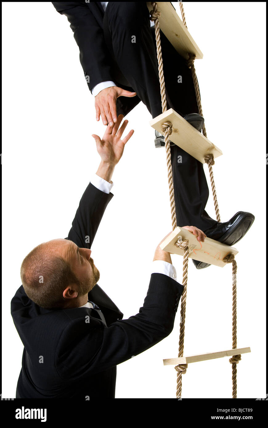 Two men climbing ladder hi-res stock photography and images - Alamy