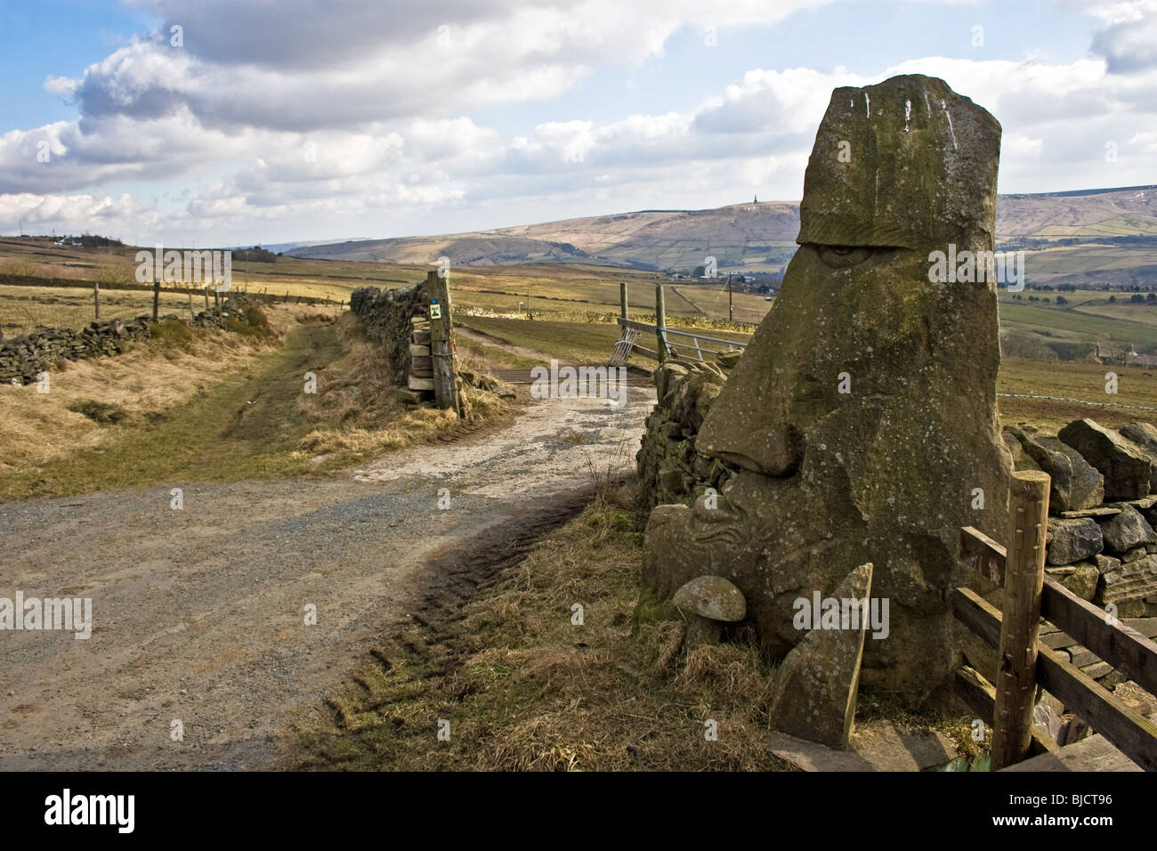 Stone head carving above Todmorden, Calder Valley, South Pennines, West ...