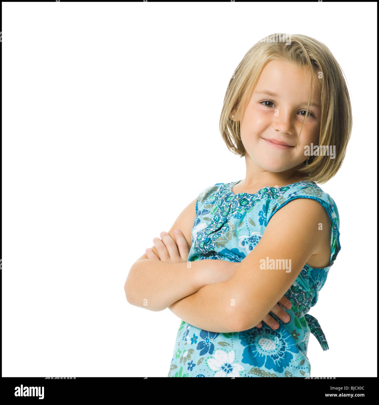 Young girl with arms folded Stock Photo - Alamy