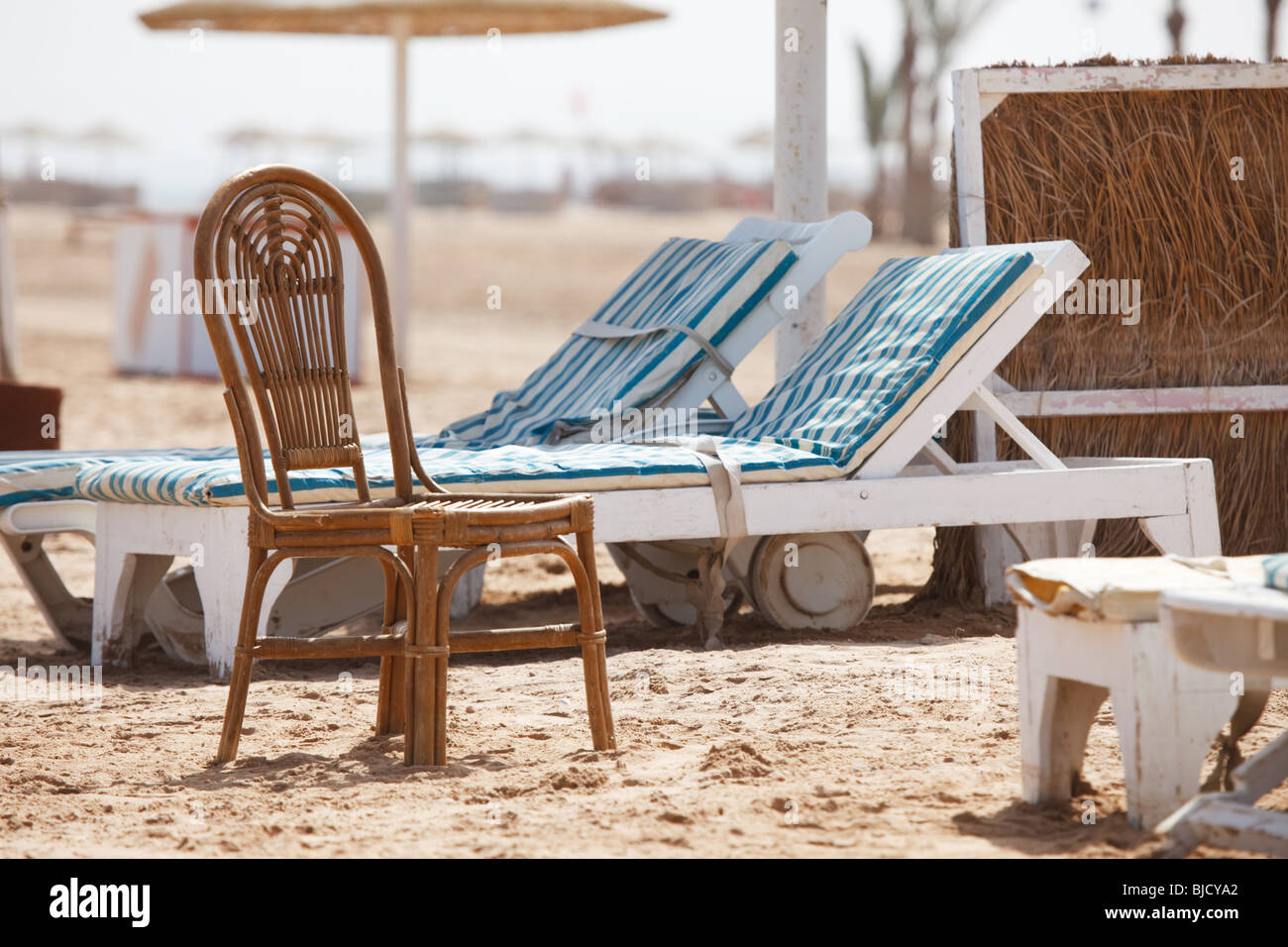 Empty sunbeds in empty beach Stock Photo - Alamy