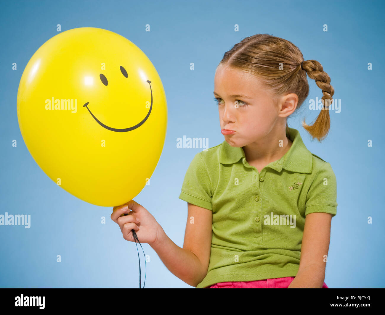 Child holding a balloon Stock Photo - Alamy