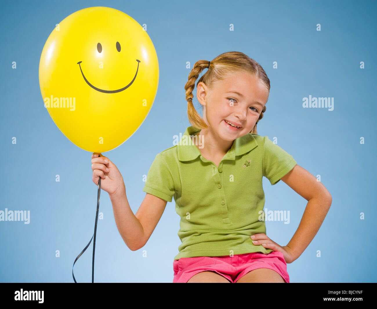 Child holding a balloon Stock Photo - Alamy