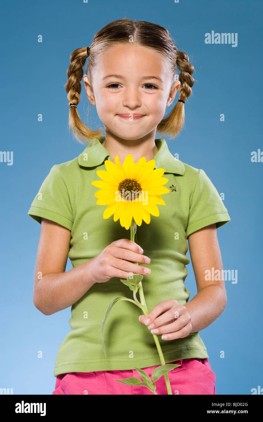 Child holding a flower Stock Photo - Alamy