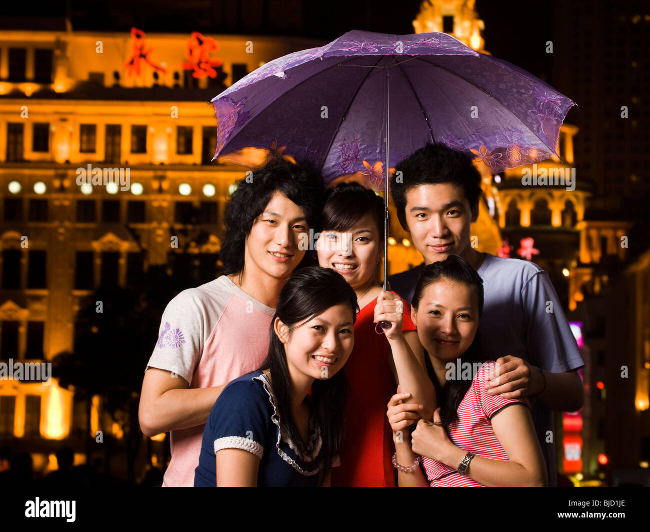 Five young people under umbrella hi-res stock photography and images ...
