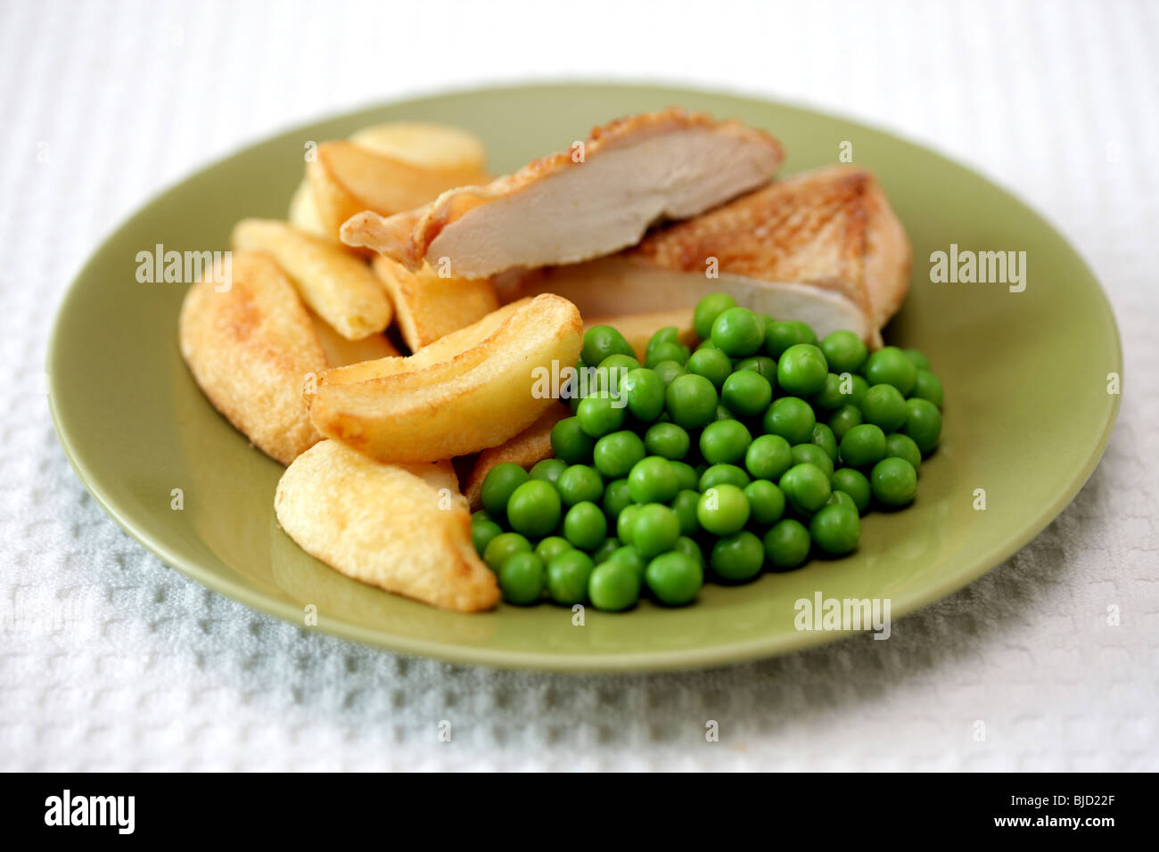 Chicken Chips and Peas Stock Photo - Alamy