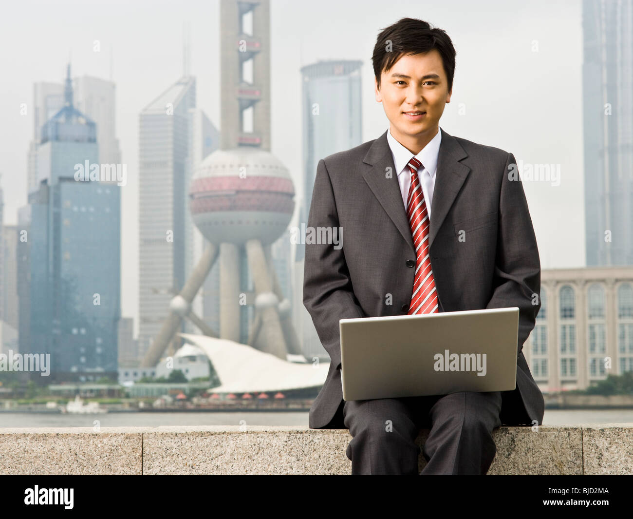 Man with a notebook computer Stock Photo - Alamy
