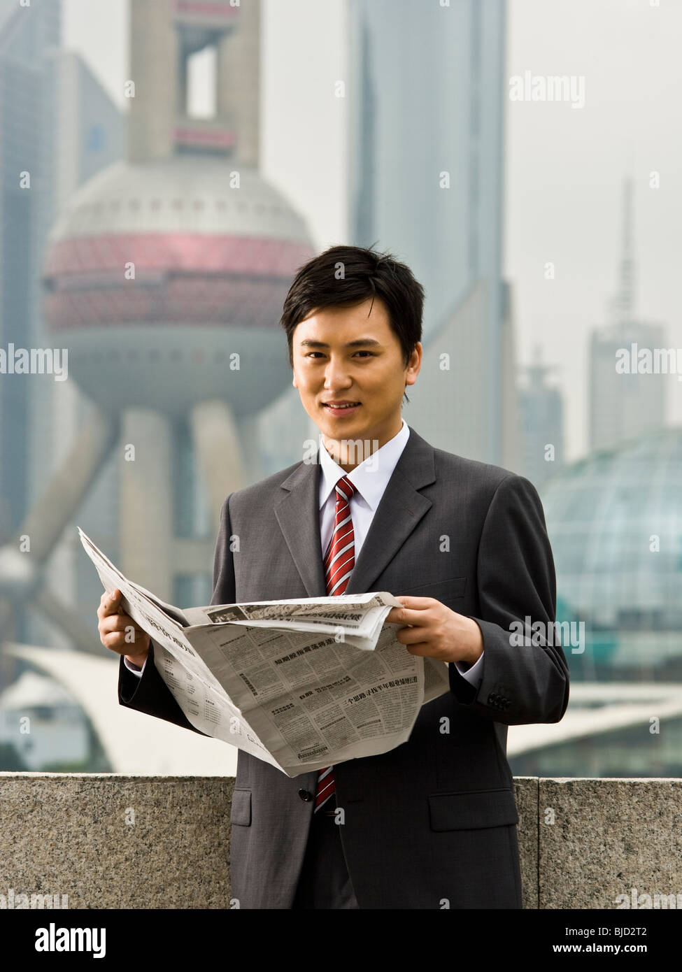 Man reading a newspaper Stock Photo - Alamy