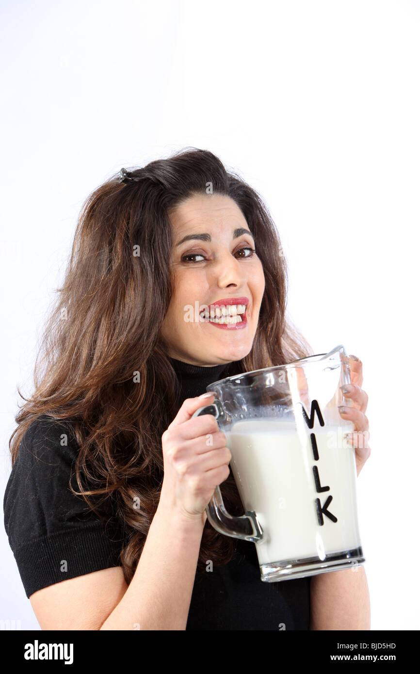 Health conscious young woman with milk - space for text Stock Photo - Alamy
