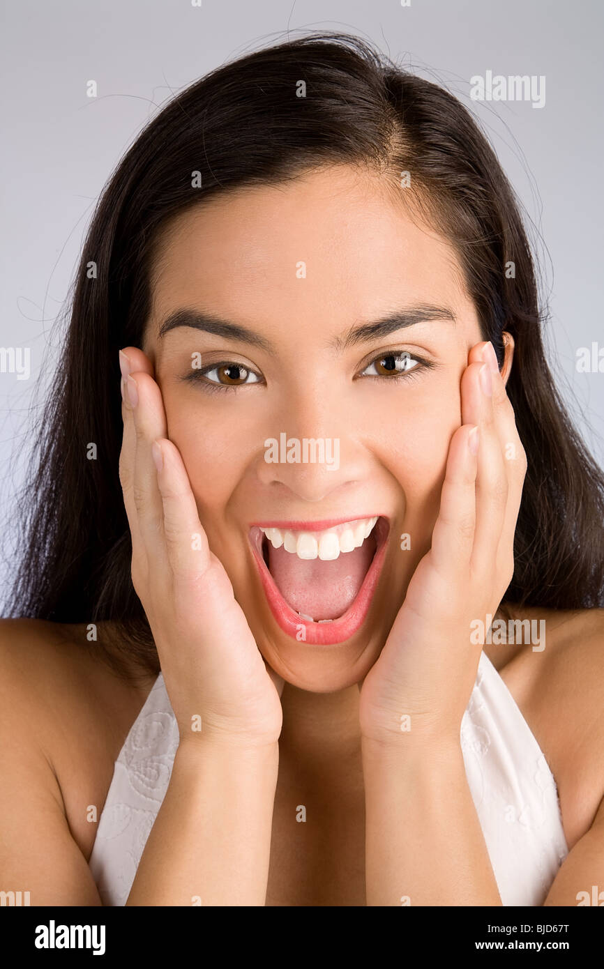 This is the expression of a woman winning something big Stock Photo - Alamy