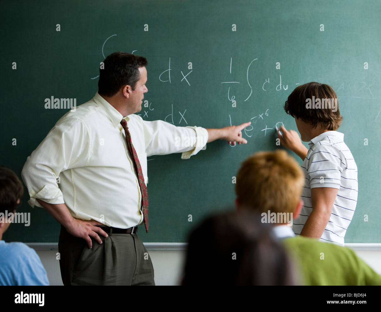 Teacher in a classroom Stock Photo - Alamy