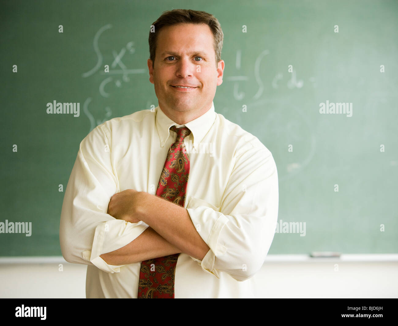 Teacher in a classroom Stock Photo - Alamy