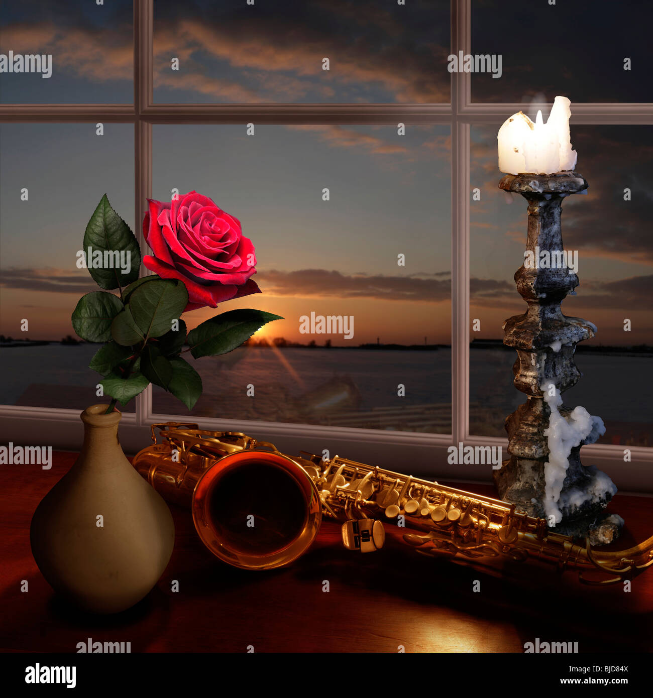 rose saxophone and candle with a a sunset on the background Stock Photo ...