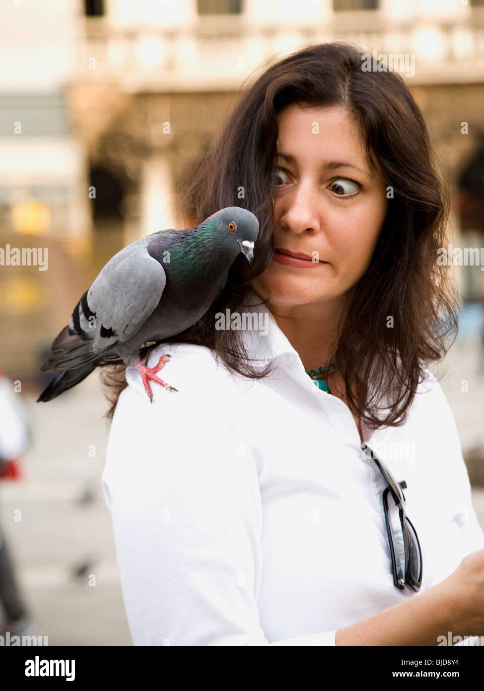 Woman with birds on her shoulder Stock Photo - Alamy