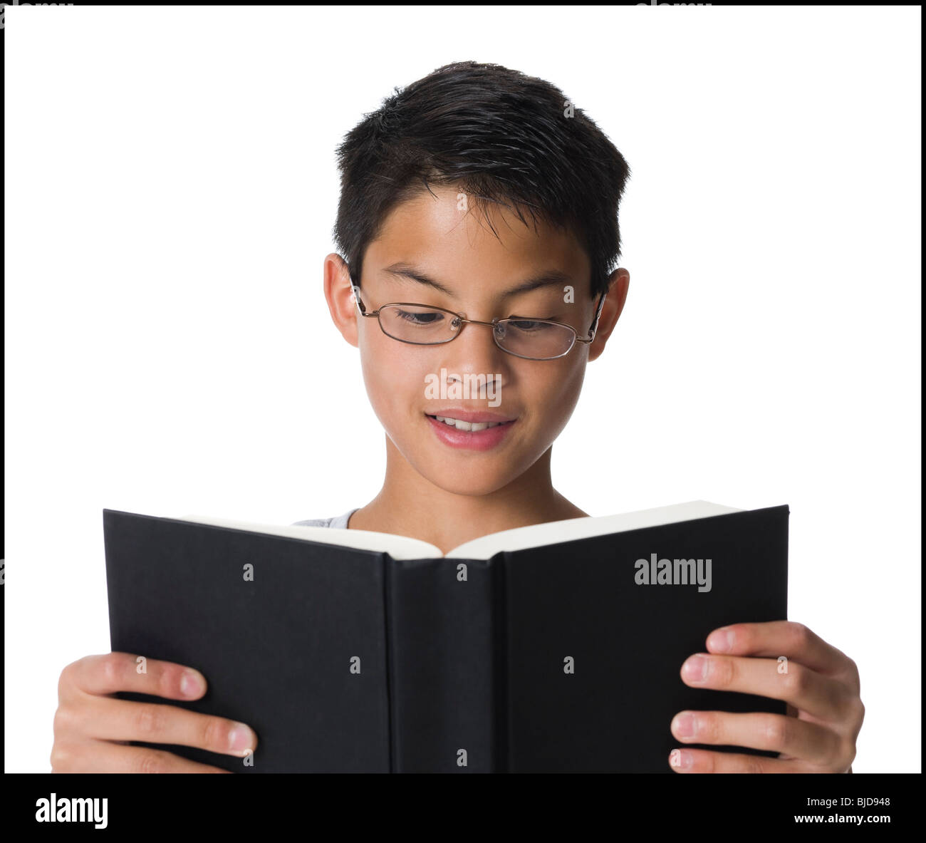 Boy reading a book Stock Photo - Alamy