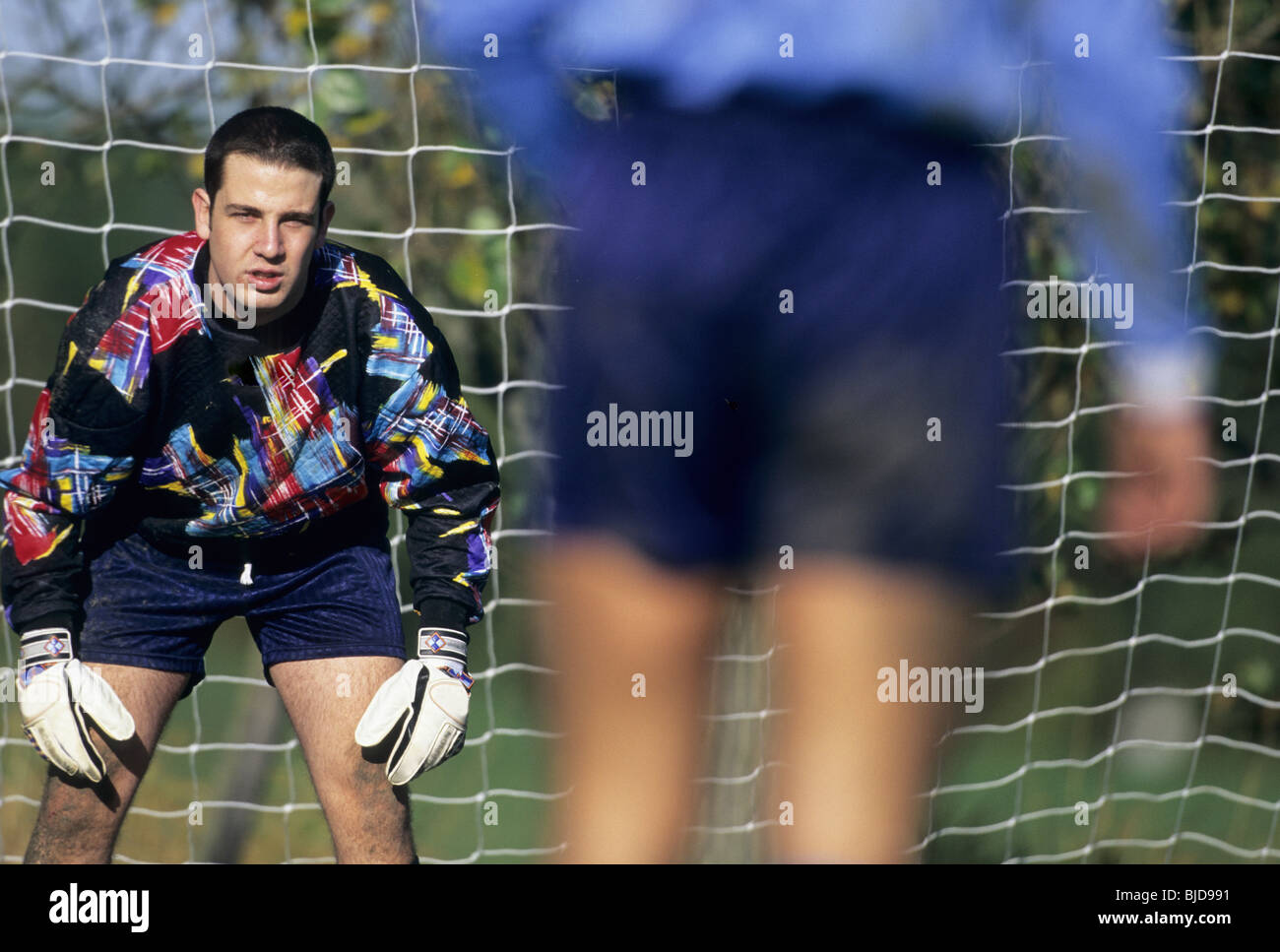 Goalkeeper standing in goal mouth prepared for penalty Stock Photo - Alamy