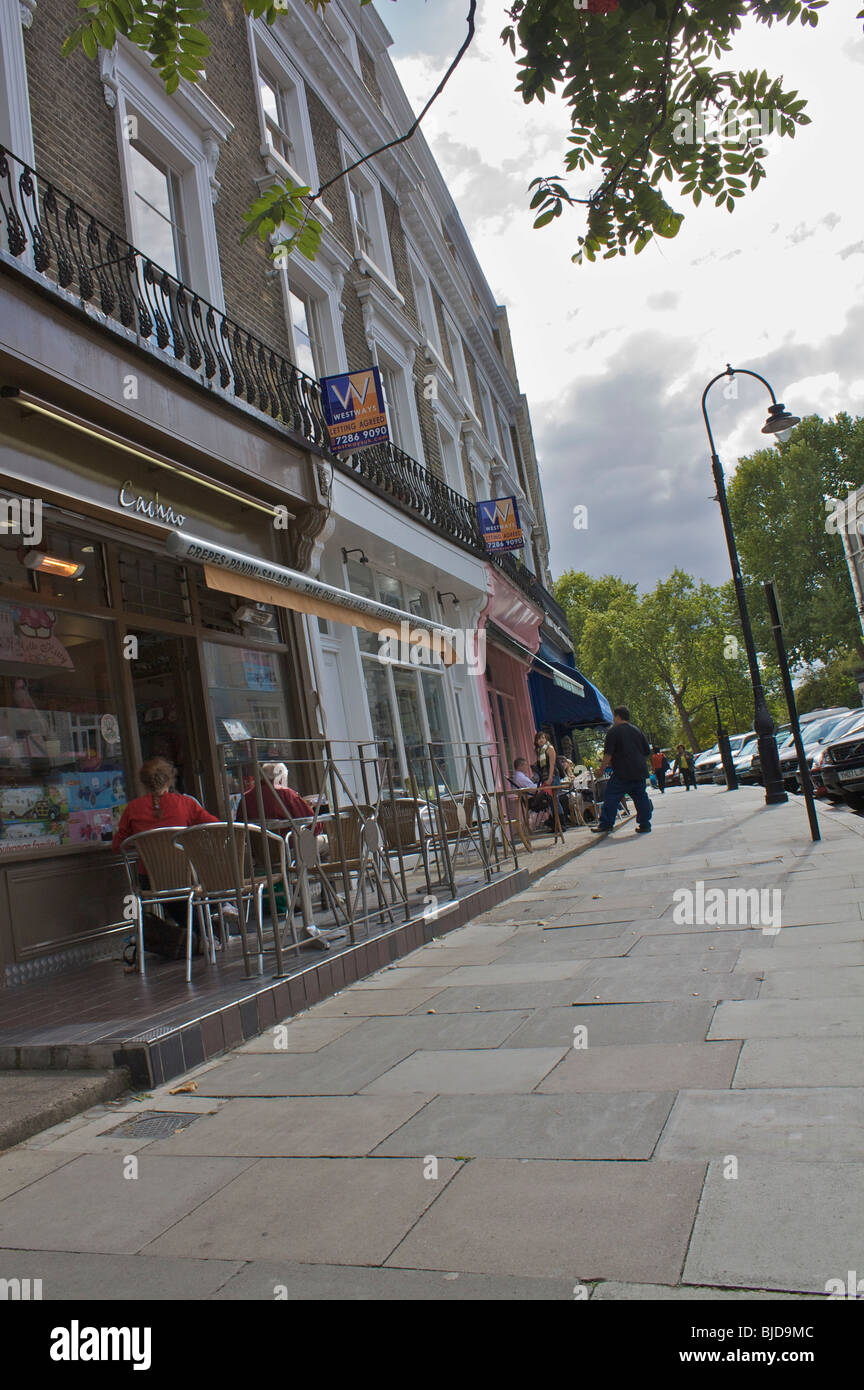 Primrose hill high street showing cafe on a sunny day Stock Photo - Alamy