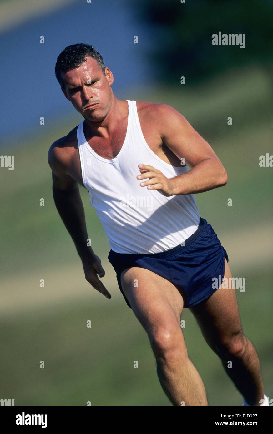 Male runner in action Stock Photo - Alamy
